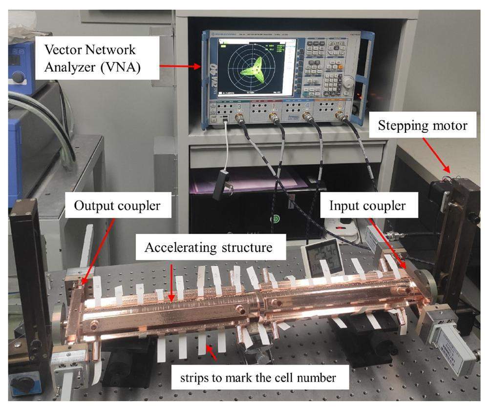 Fabrication, tuning, and high-gradient testing of an X-band traveling ...